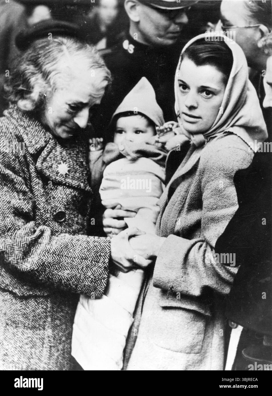 Soviet refugees, 1920, An older and a younger couple holding a baby ...