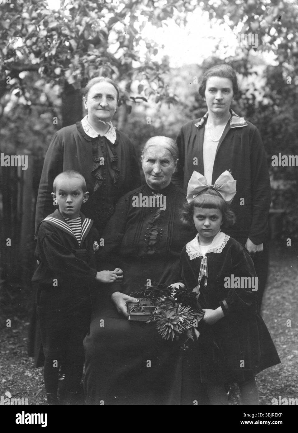 Family photo, 1920s, Three generations pose for a portrait in the ...