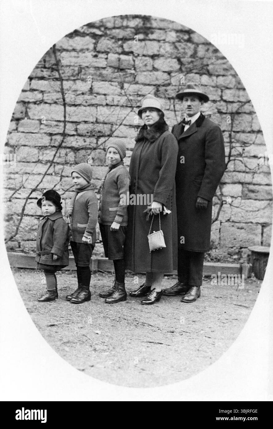 Family standing in a row, 1930s, Family in winter clothes standing ...