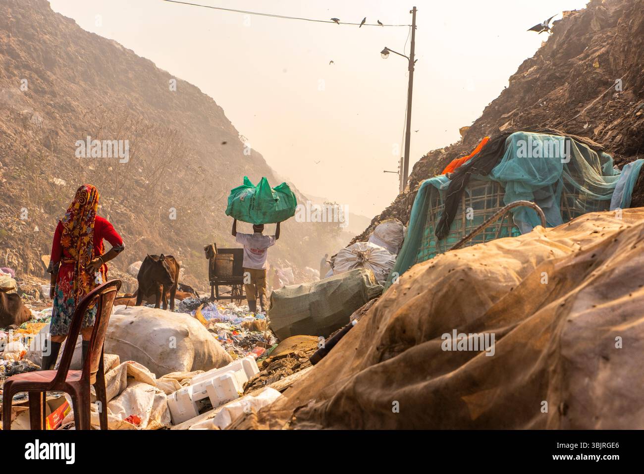 Big mixed rubbish dump and blue sky. Garbage Mountain. Garbage pile in ...