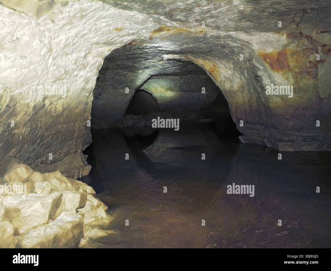 Partially flooded underground caves catacomb. journey underground ...