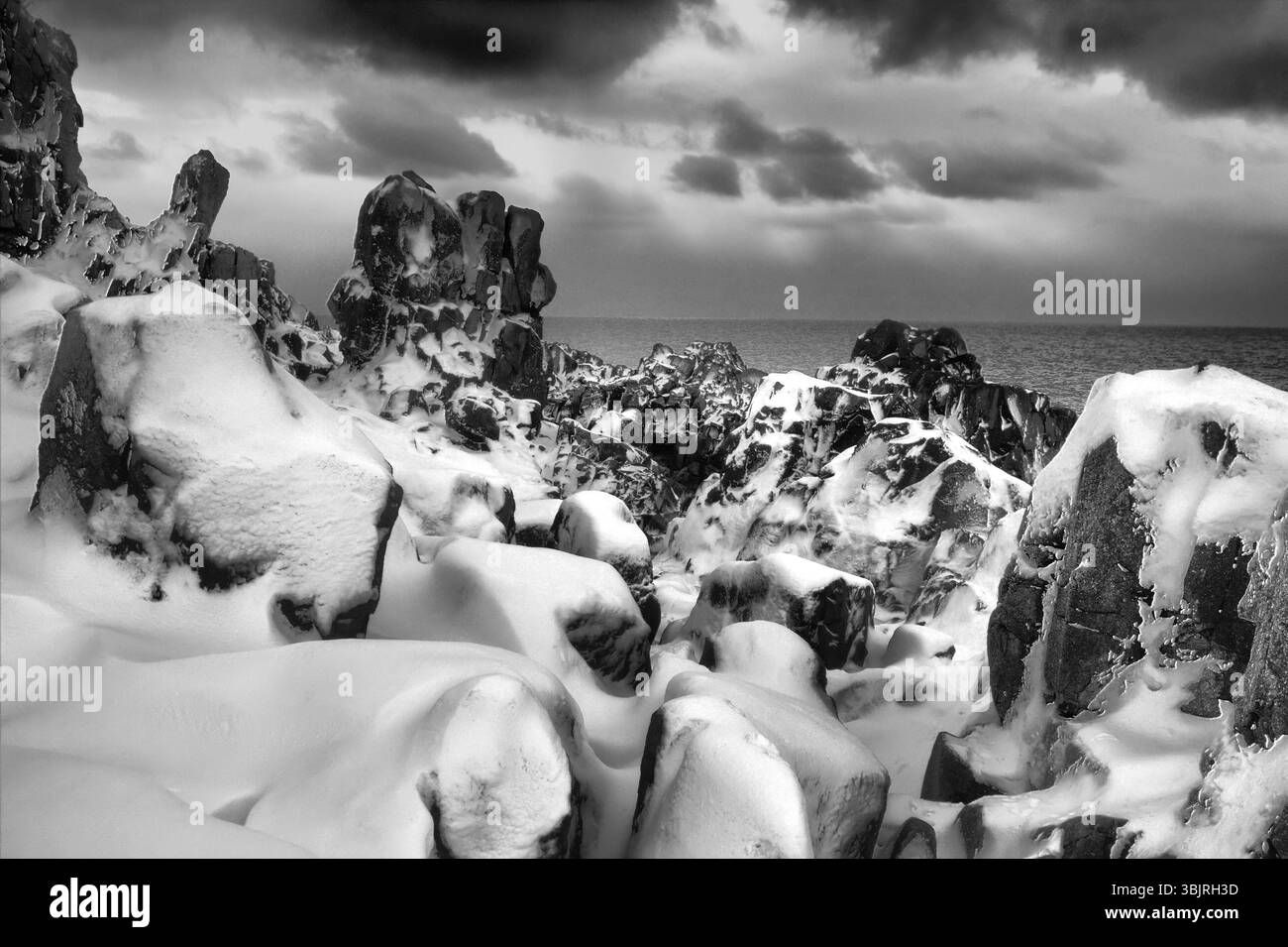 Rocky coast during a bad weather. (Commander Islands Stock Photo - Alamy