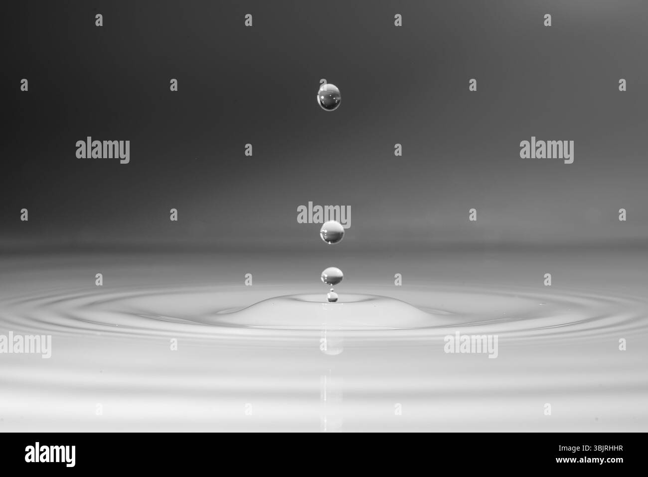 Close-up of a water drop and splash background, small impact causes big ...