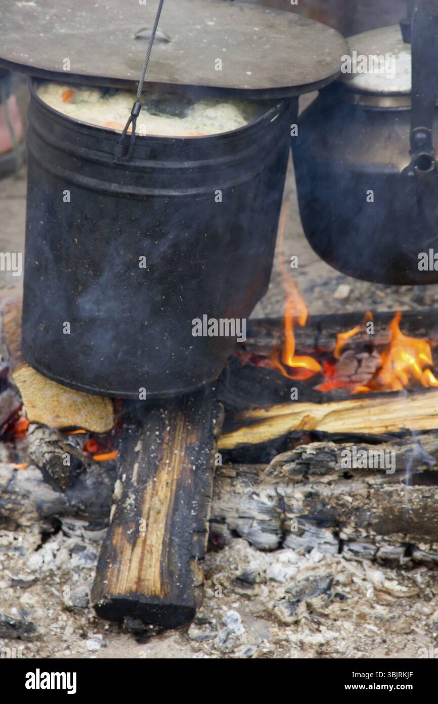 Soup on camping fire. food in pot in recreation Stock Photo - Alamy
