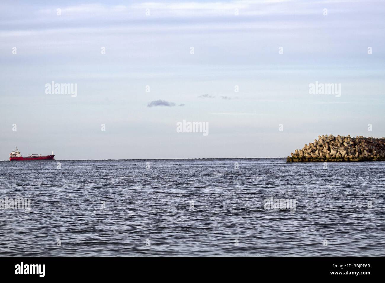 The seawall around the sea port facilities is made of concrete ...