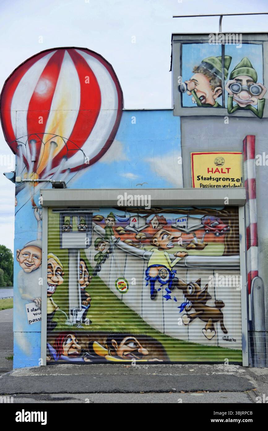 Colourful comic scene with hot air balloon and comic figures painted on ...