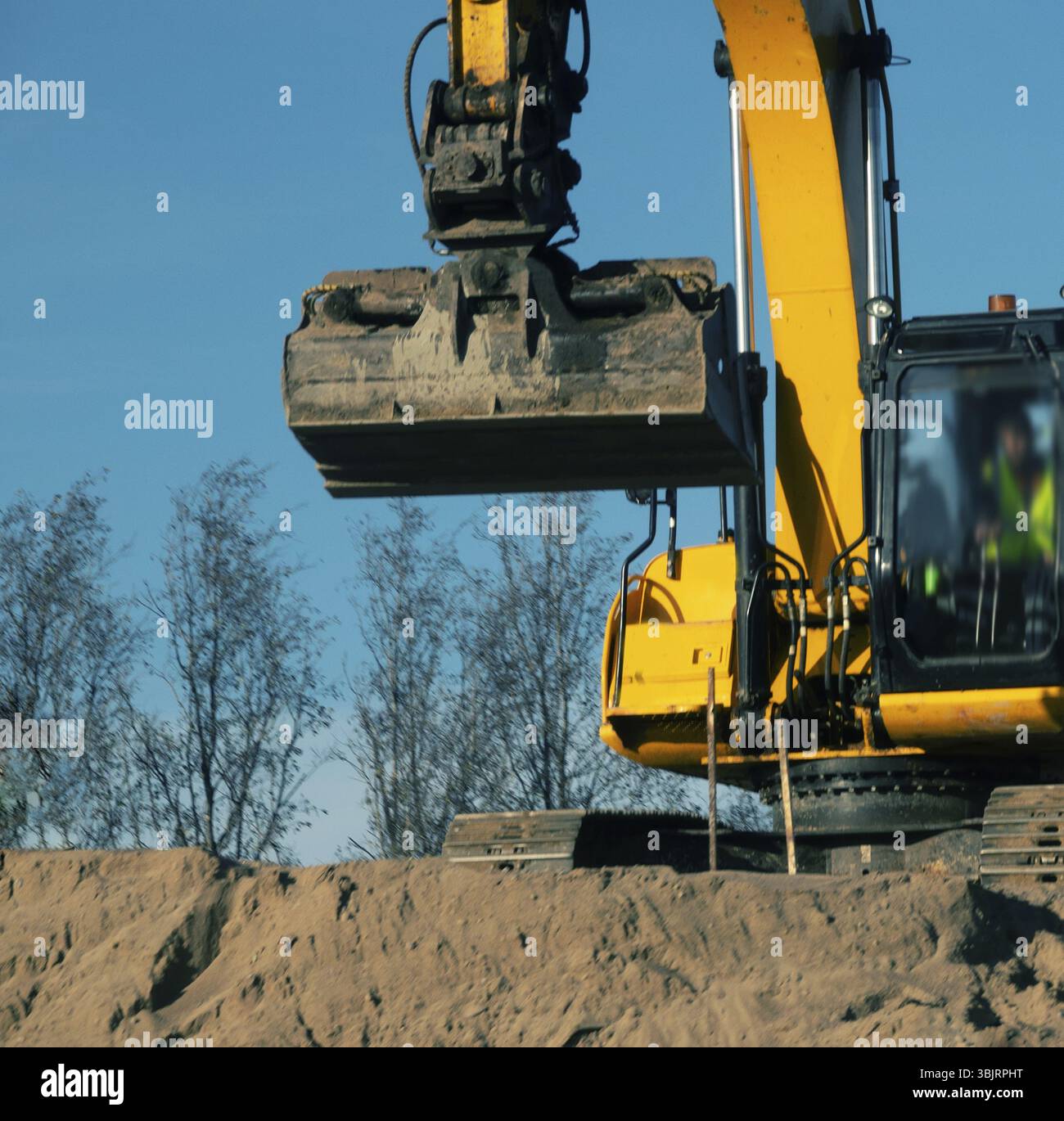 Construction of the highway. The work of earthmoving equipment ...