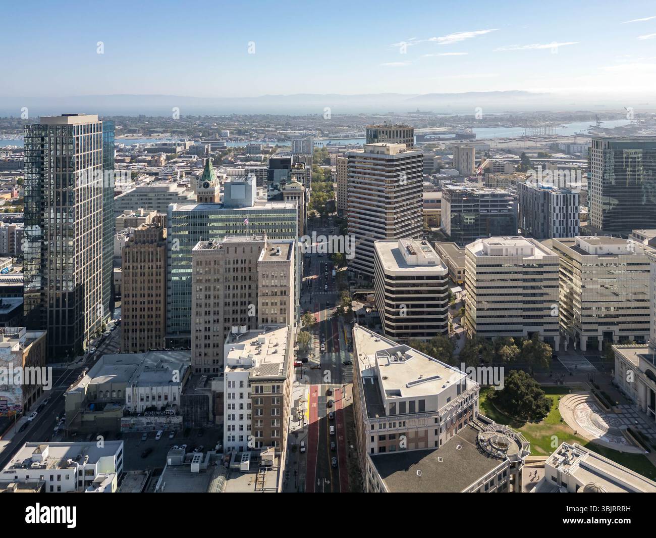 Aerial views of downtown Oakland skyline, highways, and high-rise ...