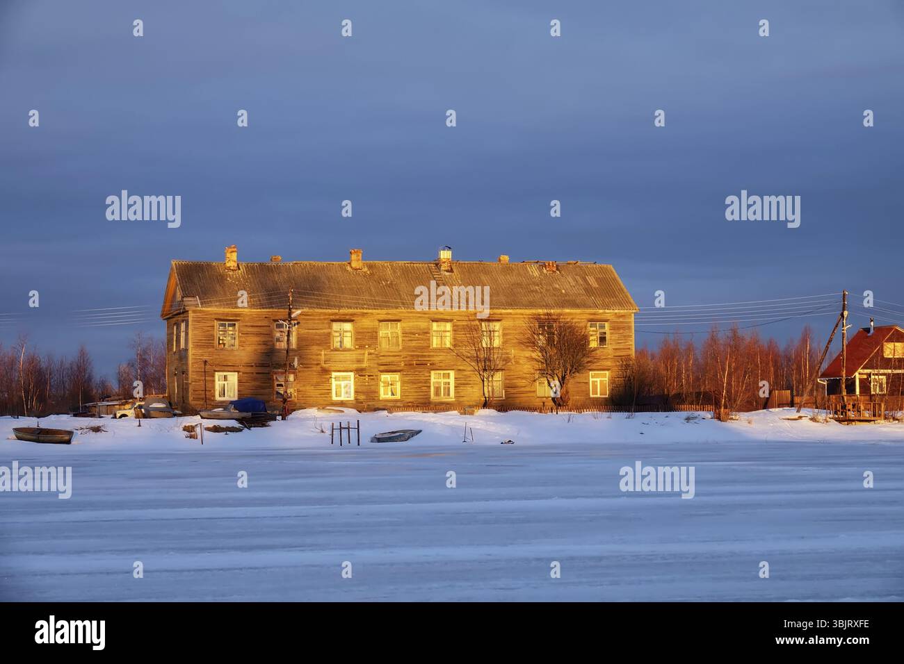 Two-storey log houses (barracks) on Northern river, village. North ...