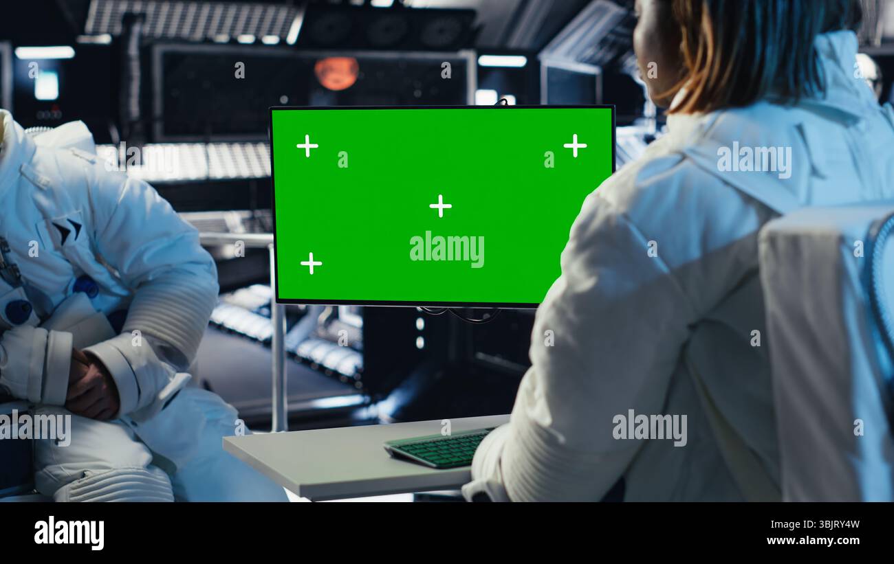 Team of cosmonauts calibrating starship sensors using isolated screen ...