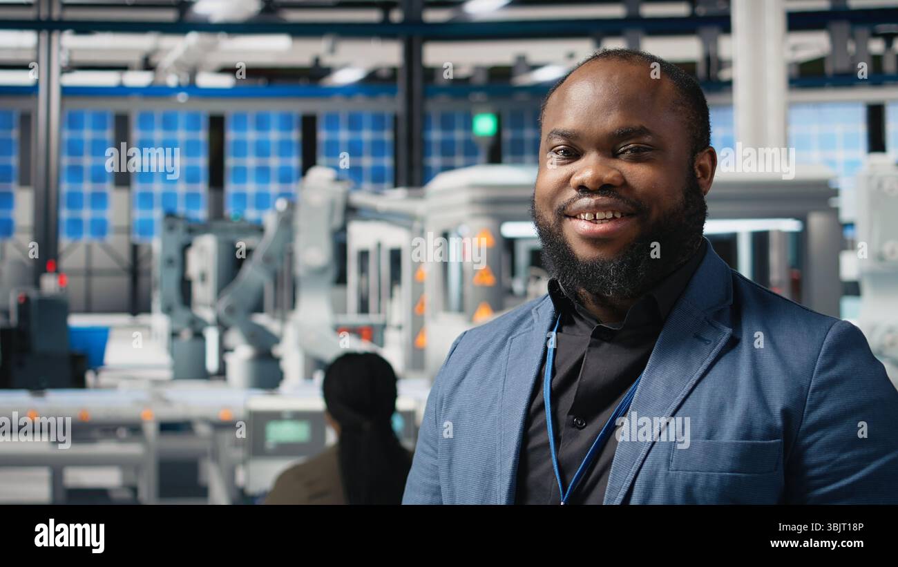 African american male engineer reviewing the production line activity ...
