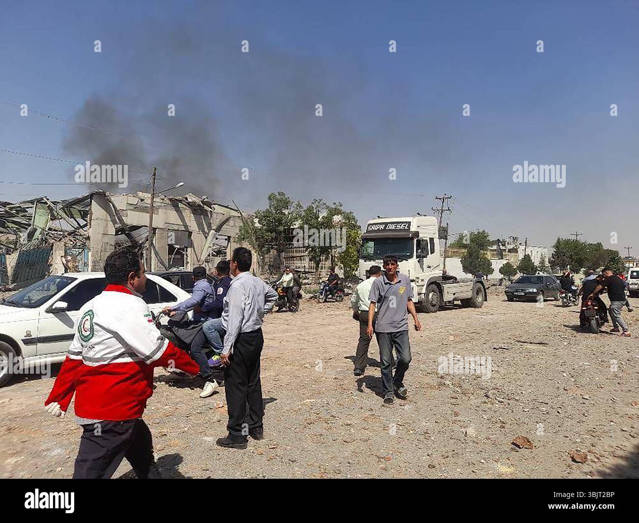 Tehran, Iran. 16th June, 2025. Iranian Red Crescent volunteers treat ...