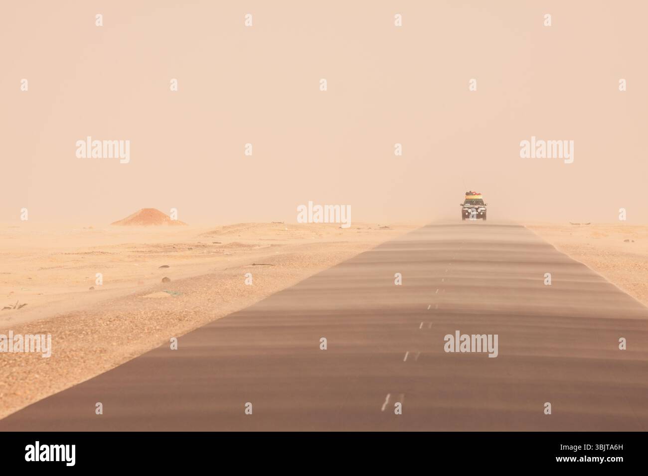 A vehicle crosses the Western Sahara desert during the Budapest-Bamako ...