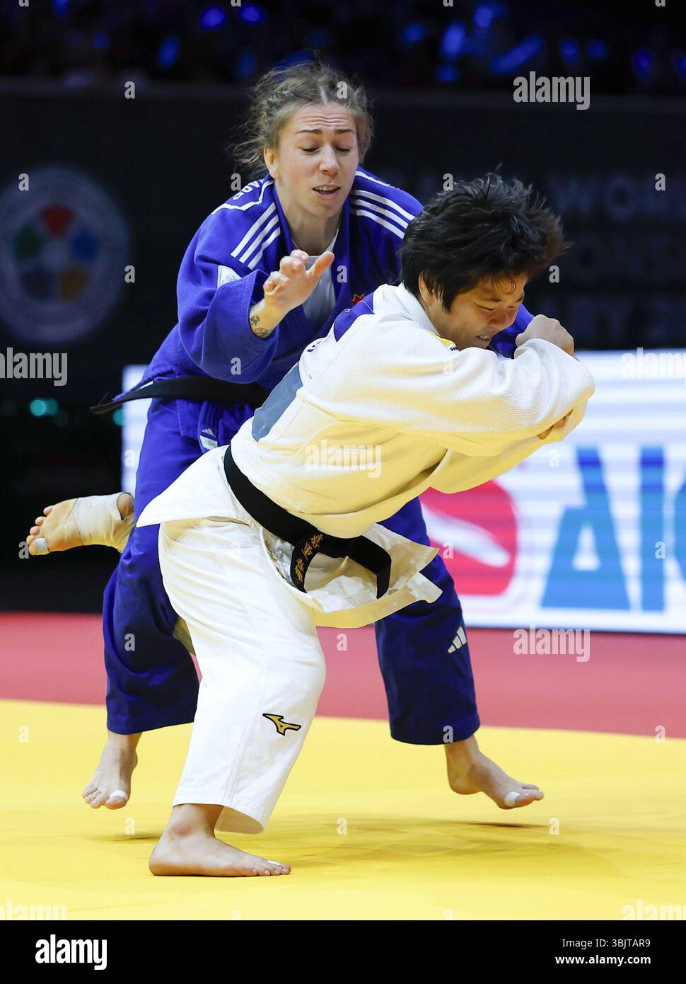 Japan's Haruka Kaju (white) competes against Canada's Catherine ...