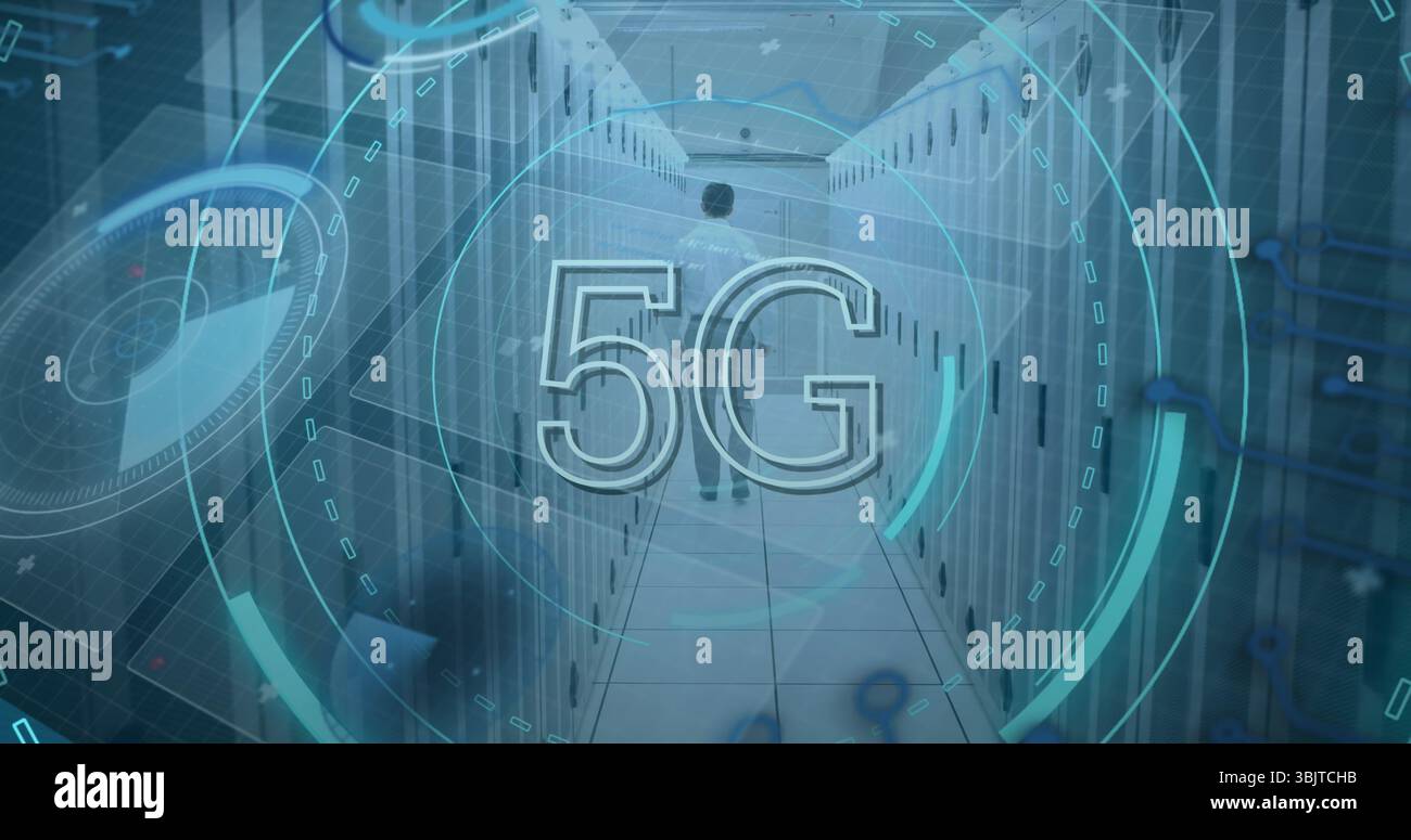 Network technician monitoring server racks and cables in data center ...