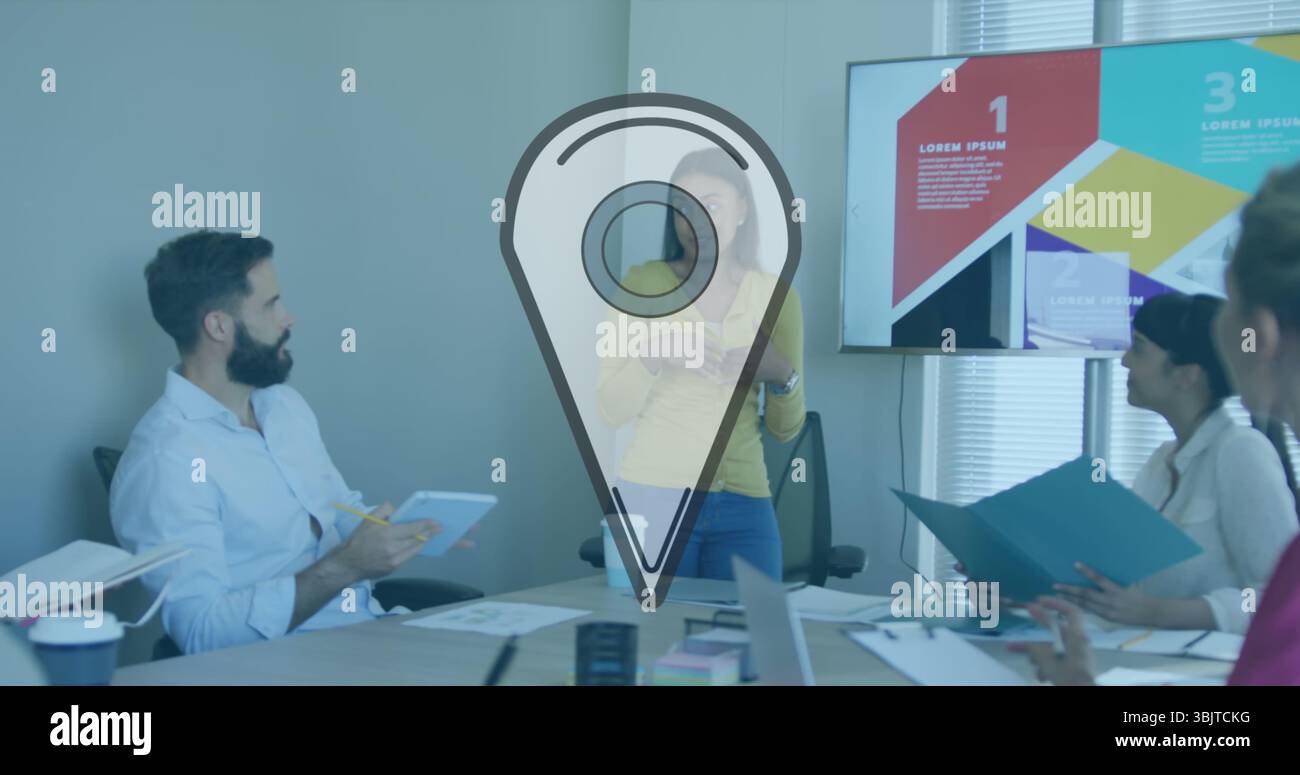 Presenter in yellow top explaining slide on display in boardroom with ...