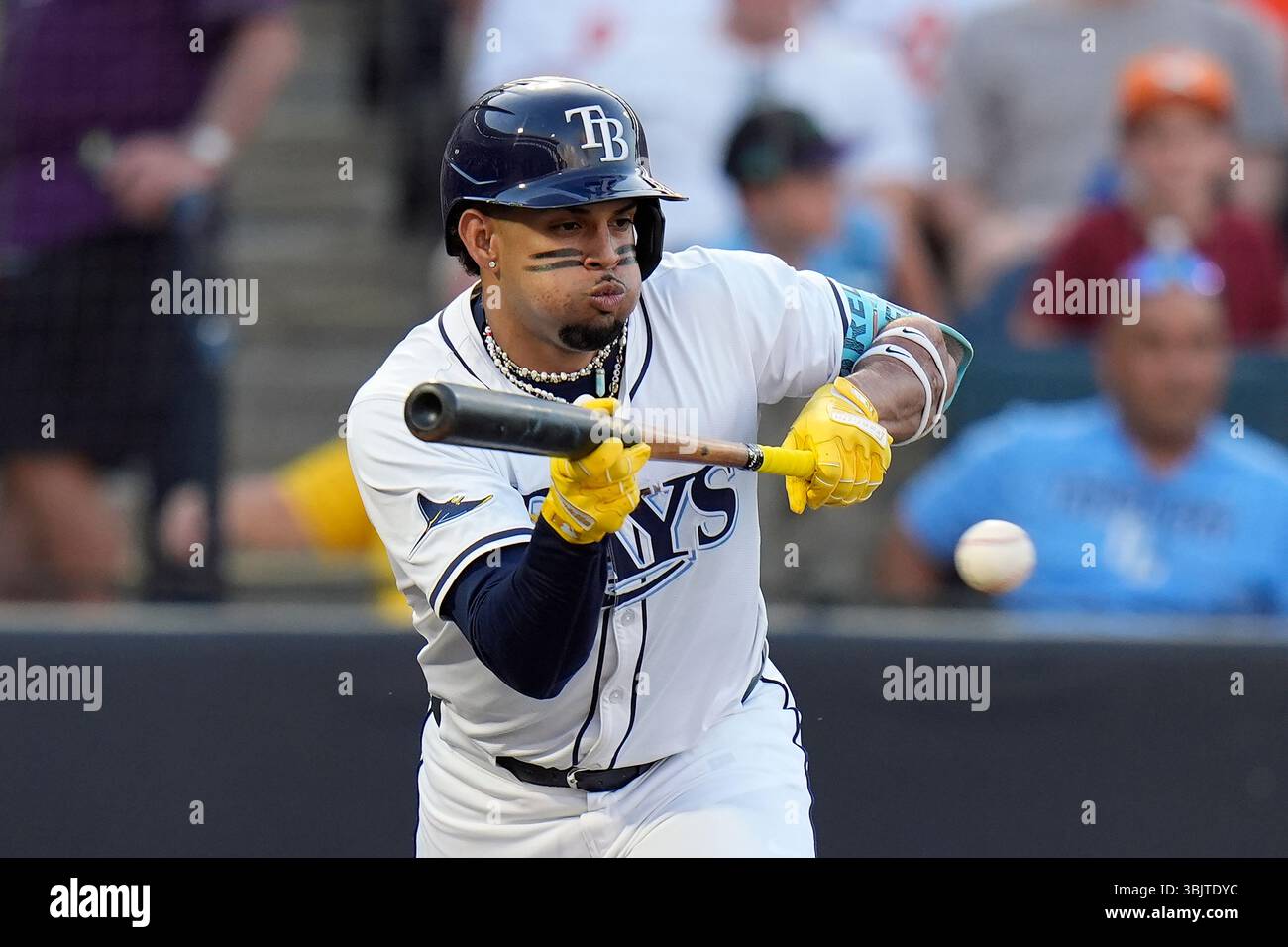 Tampa Bay Rays' Christopher Morel drops down a bunt RBI single off ...