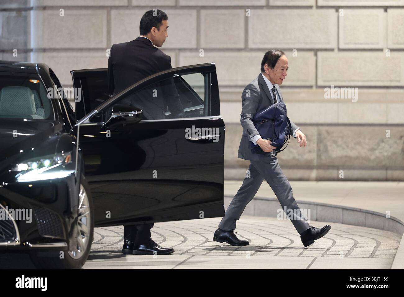 Bank of Japan (BOJ) Governor Kazuo Ueda enters the BOJ's headquarters ...