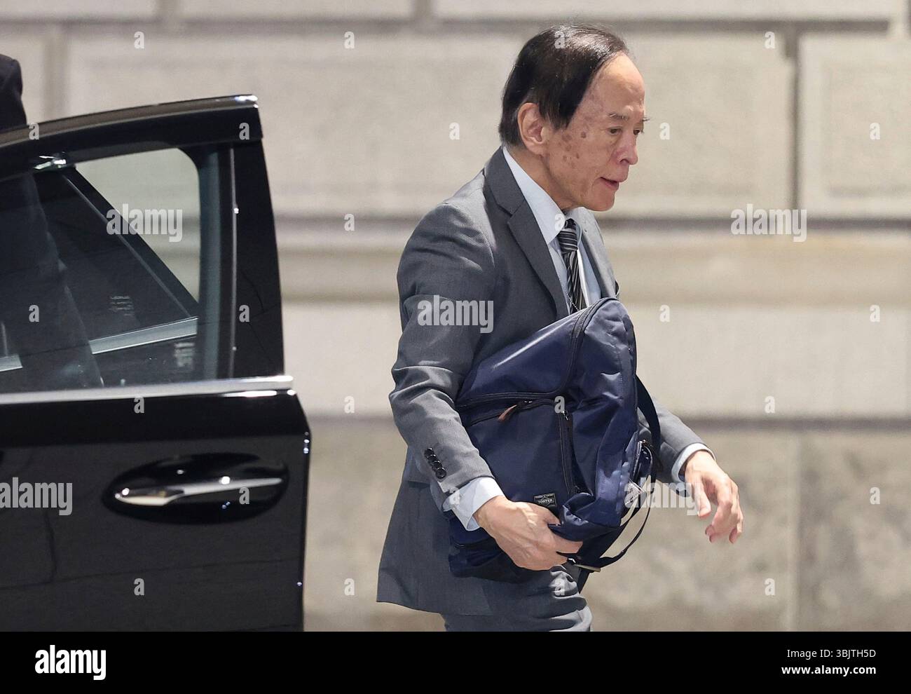 Bank of Japan (BOJ) Governor Kazuo Ueda enters the BOJ's headquarters ...