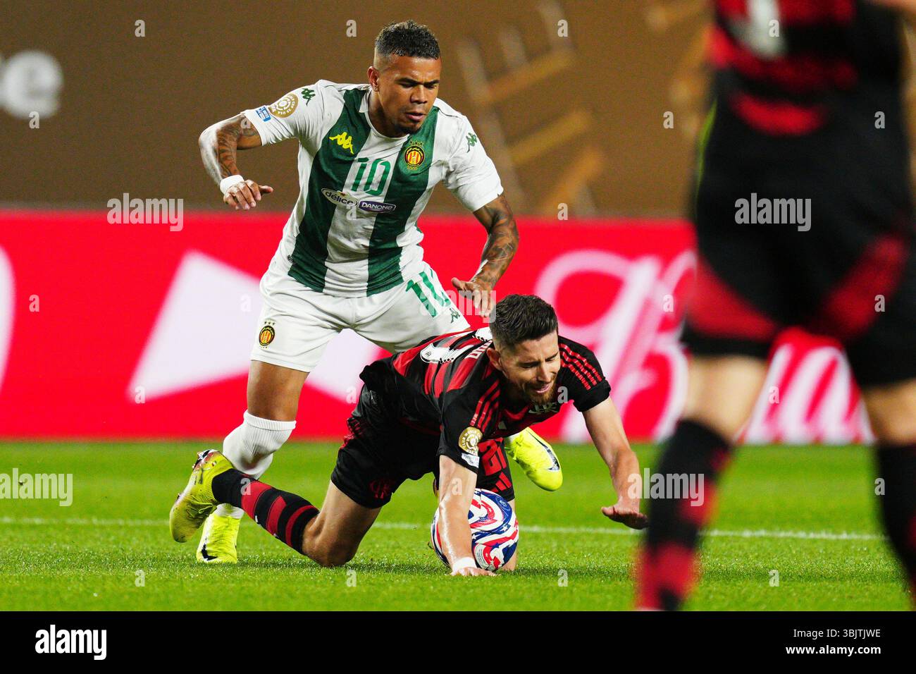 Esperance de Tunis' Yan Sasse, left, collides with Flamengo's Jorginho ...