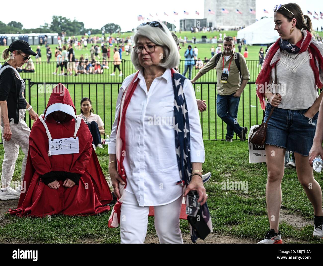 An anti-Trump protester dressed as a "handmaiden" from the dystopian ...