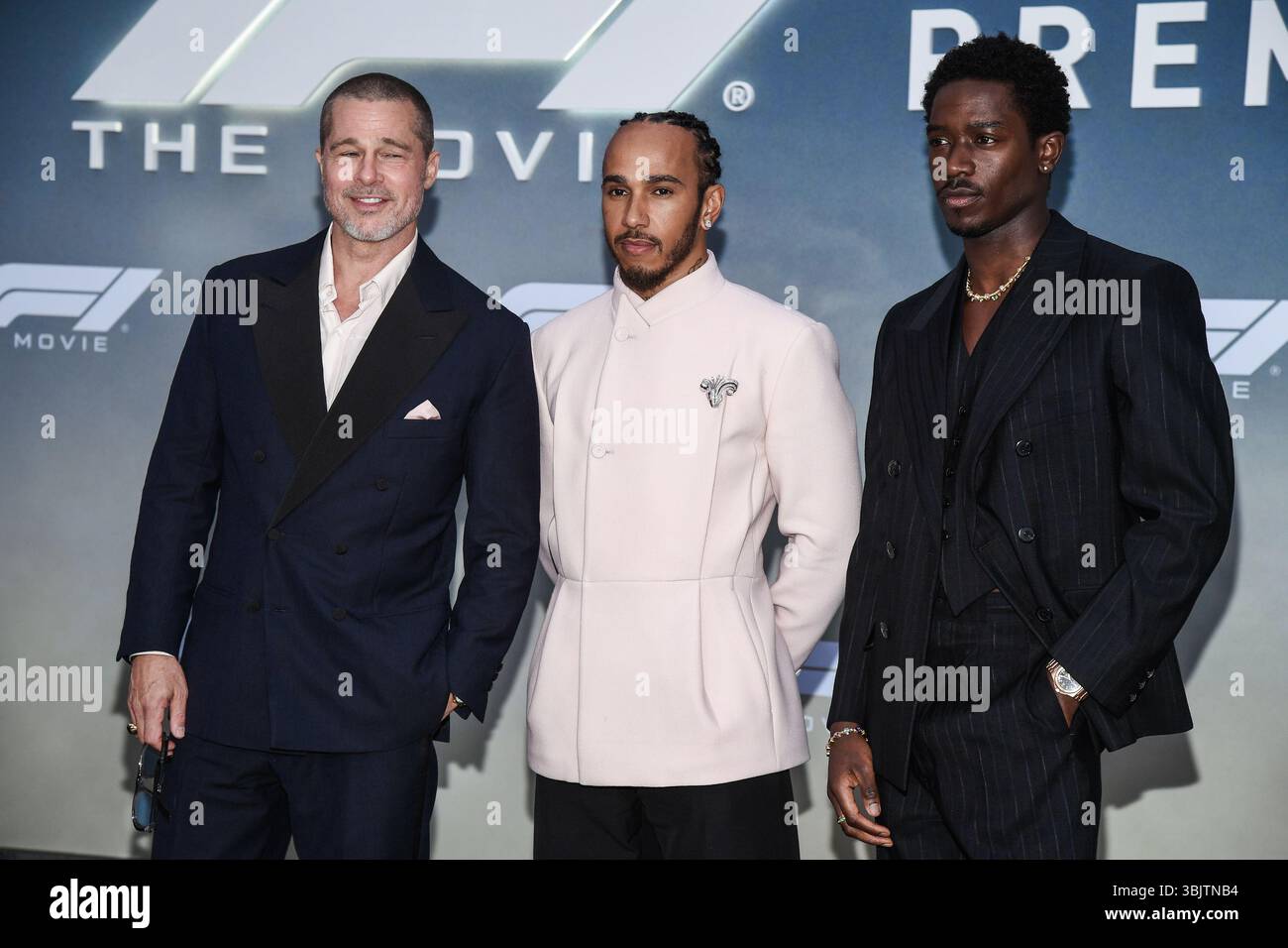 Brad Pitt, Lewis Hamilton and Damson Idris walking on the red carpet ...