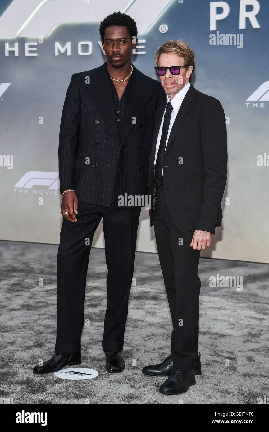 Damson Idris and Jerry Bruckheimer walking on the red carpet during “F1 ...