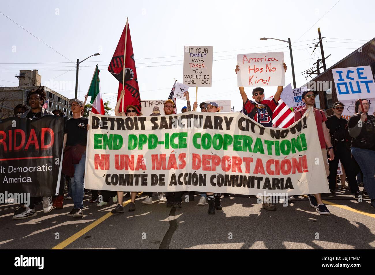 Detroit, Michigan, USA. 14th June, 2025. Protesters hold a banner as ...