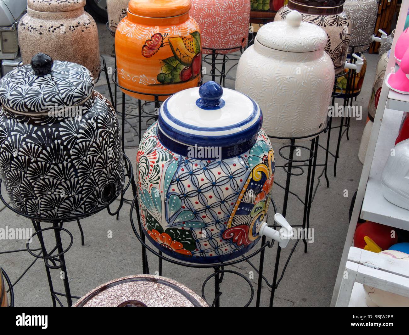 Colorful Talavera pottery stands proudly in a bustling market in Mexico ...