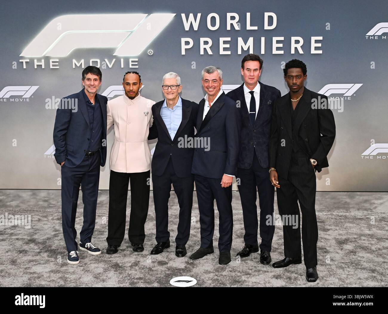 Jamie Erlicht, from left, Lewis Hamilton, Tim Cook, Eddy Cue, Zack Van ...