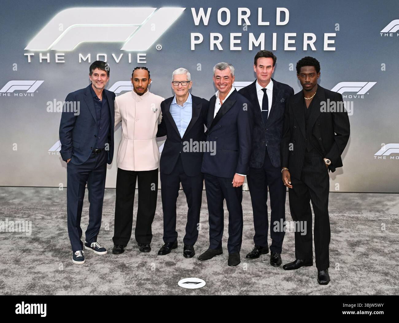 Jamie Erlicht, from left, Lewis Hamilton, Tim Cook, Eddy Cue, Zack Van ...