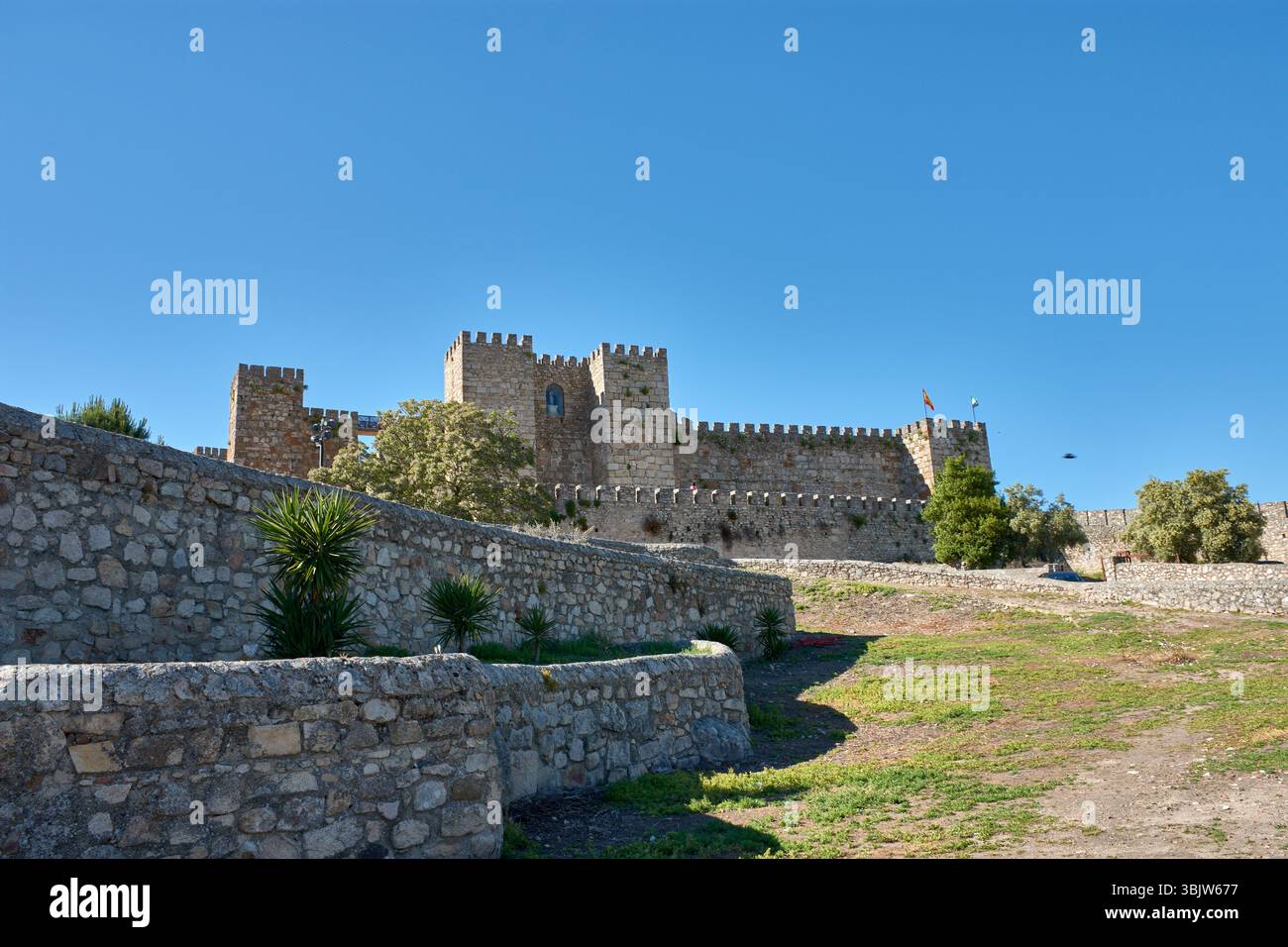 Trujillo Castle rises majestically on a hillside with stone steps and ...