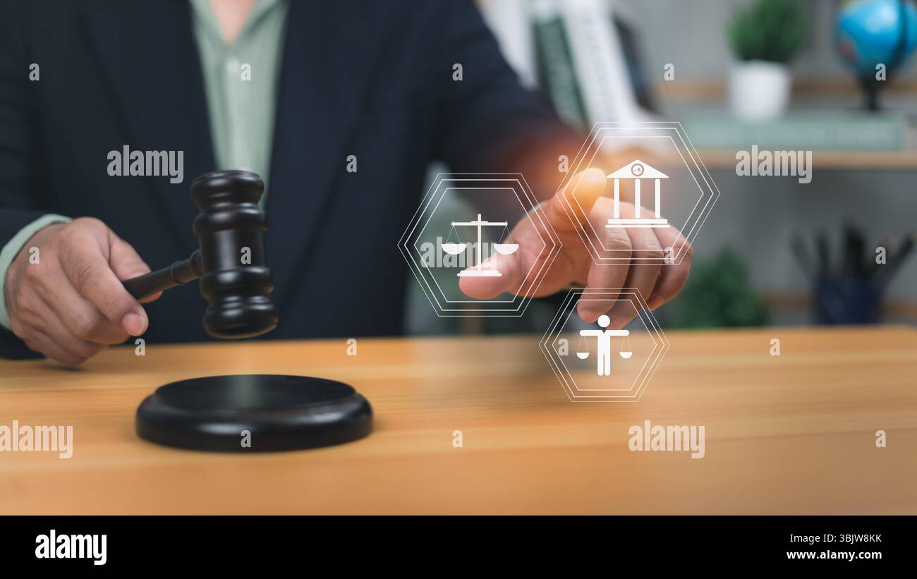 Human holding gavel pointing to holographic icons scales of justice ...