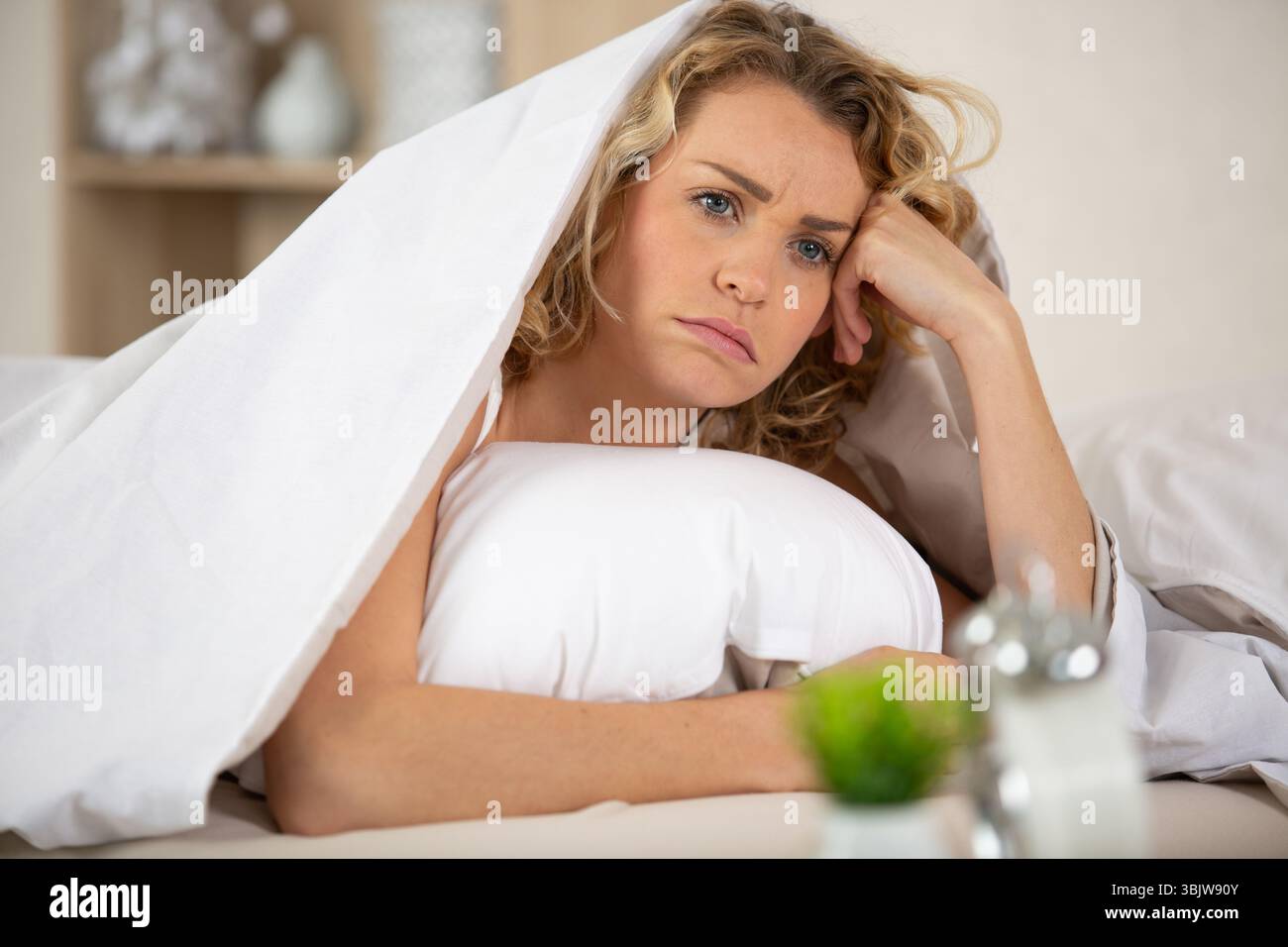 Awake girl feeling headache sitting hi-res stock photography and images ...