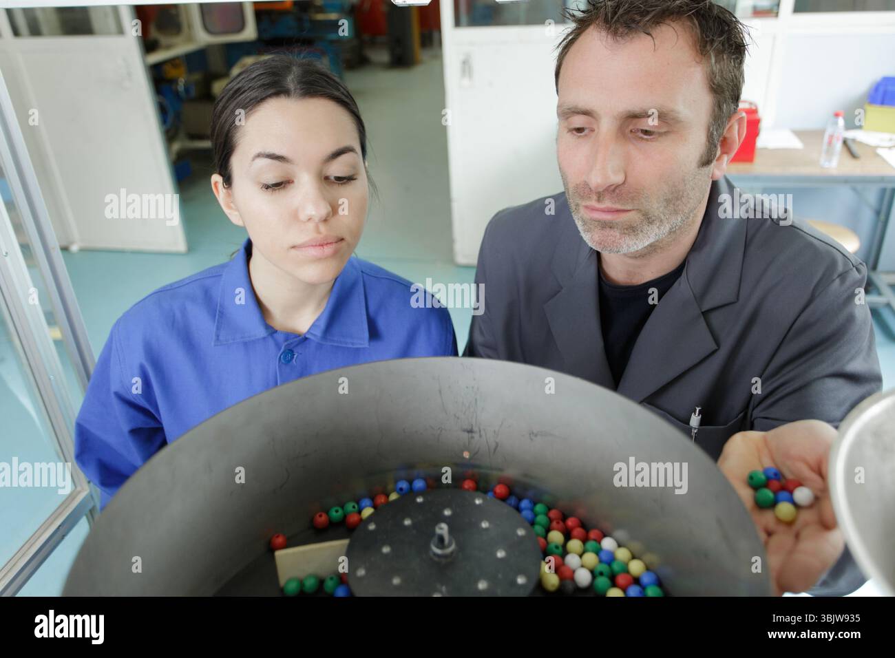 workers male female workplace apprenticeship Stock Photo - Alamy