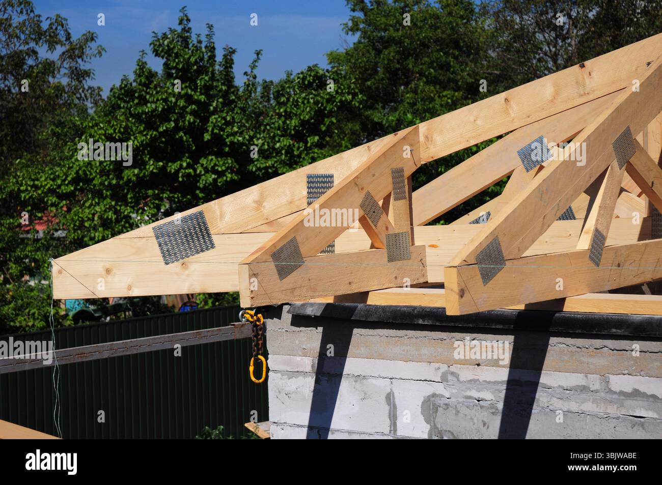 Roofing construction house corner roof with wooden beams, trusses ...