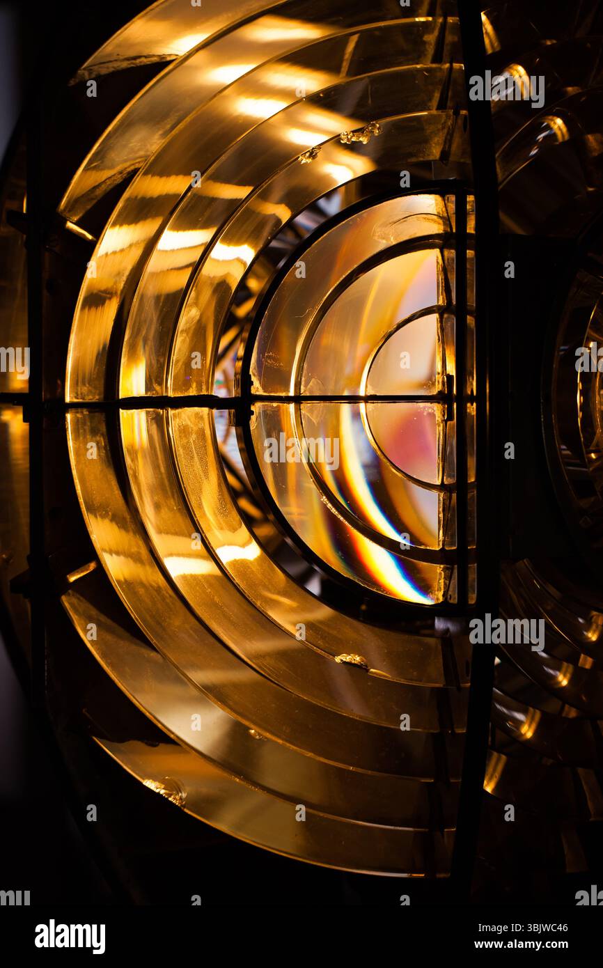 Vertical view showcasing a lighthouse Fresnel lens, capturing intricate ...