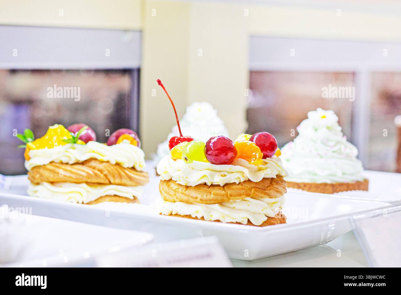 shortbread cake with pink berry butter cream and berry pieces Stock ...