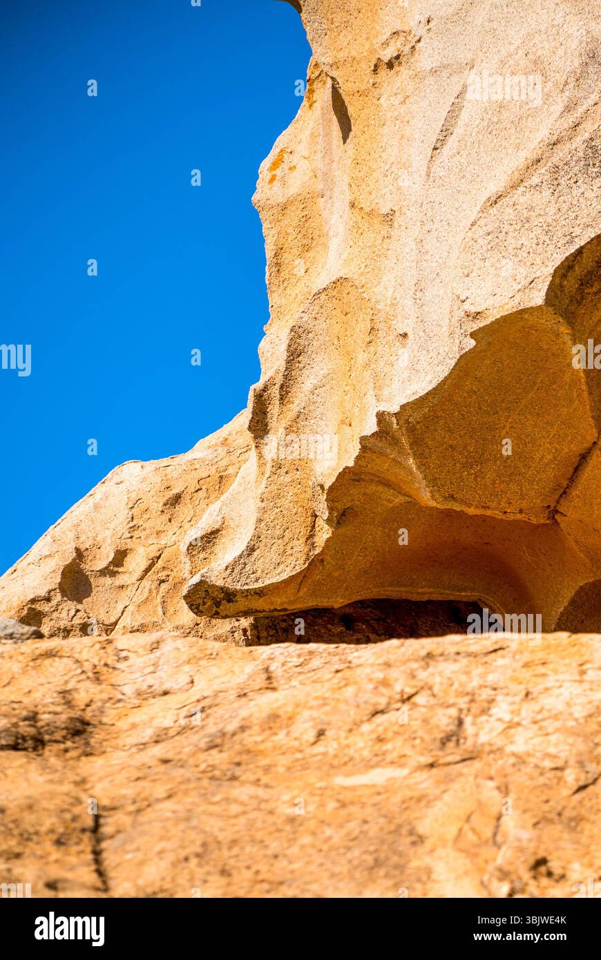A rock, desert sandy formations, a natural arch Arco de las Penitas in ...