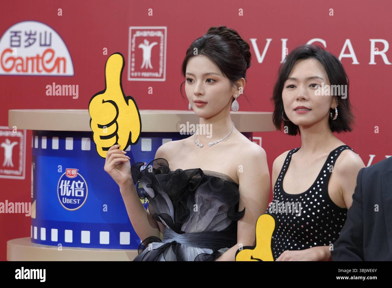 Chinese actress and singer Yang Chaoyue (left) poses for a photo on the ...