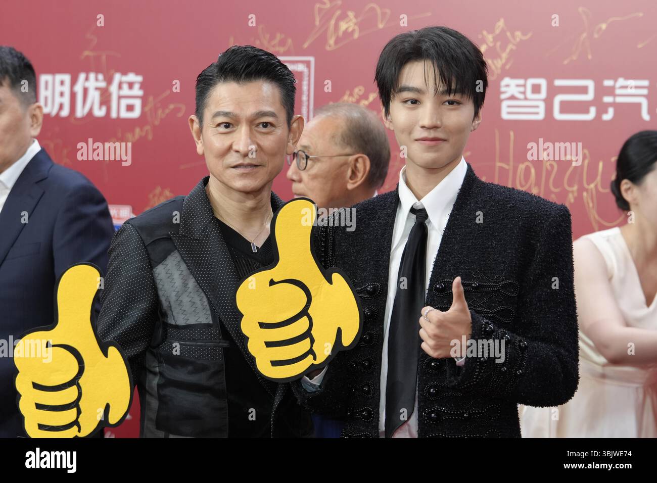 Hong Kong actor, singer-songwriter and film producer Andy Lau (left ...
