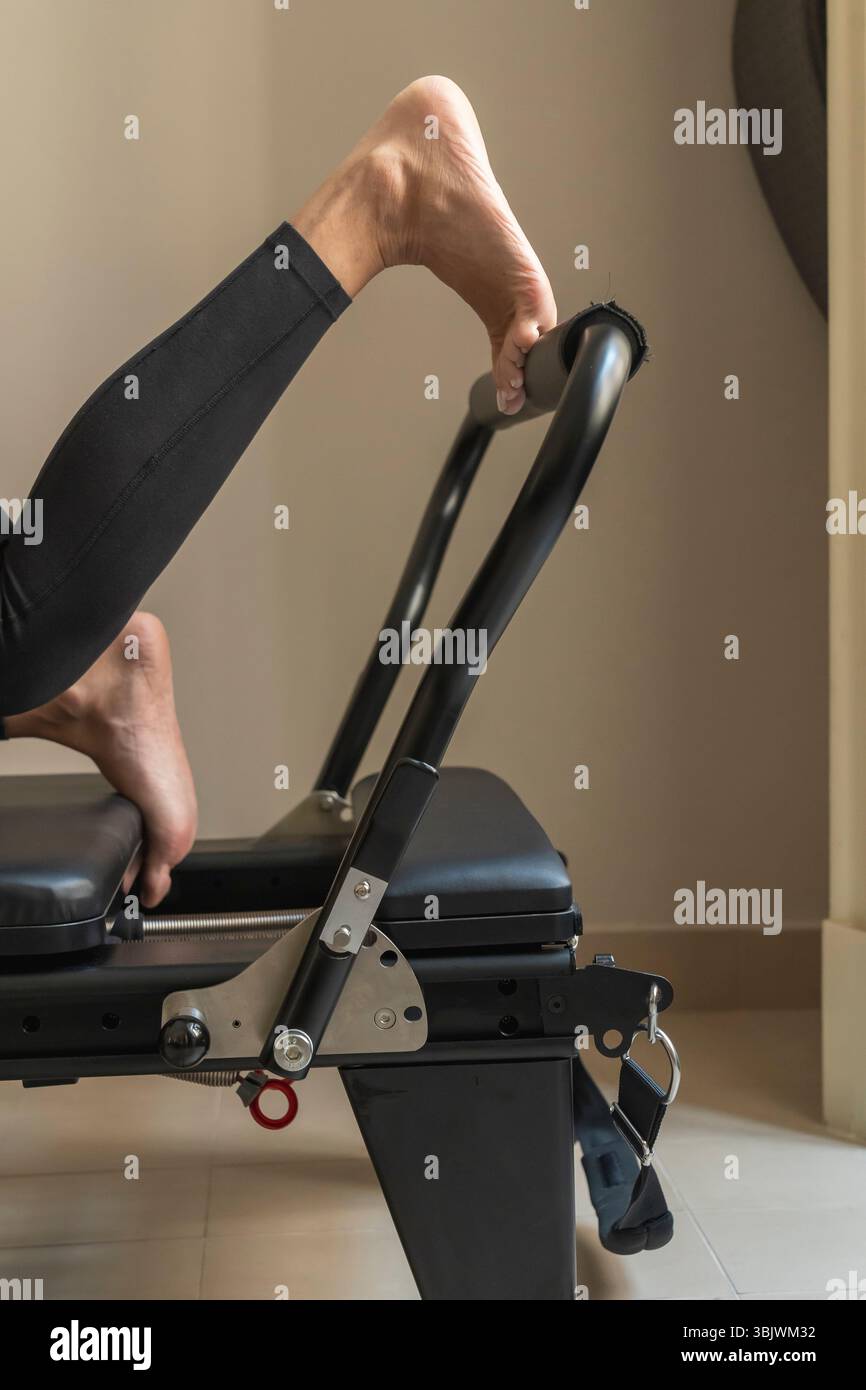 Detailed close-up of the mechanical parts of a pilates reformer ...