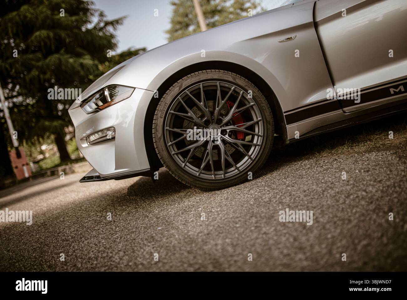 Rome, italy 17 june 2025, low angle view of a silver ford mustang ...