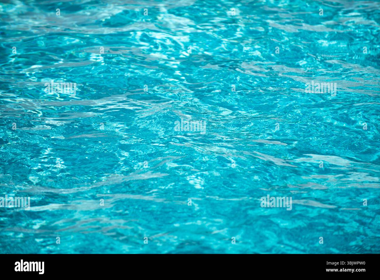 Background of blue water in swimming pool with sun reflection, ripple ...