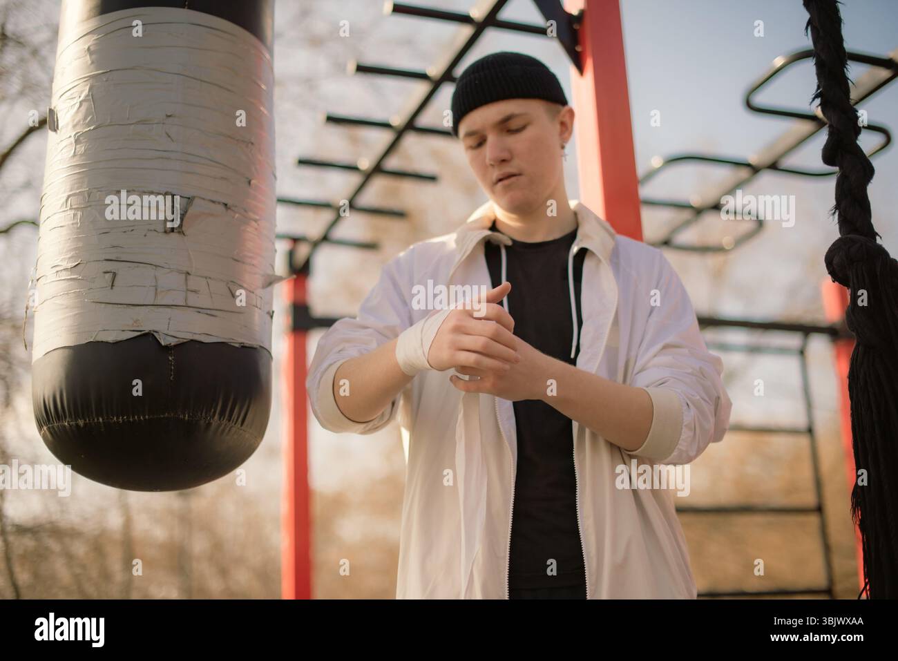 Teen boxing fighter getting ready for training outside Stock Photo - Alamy