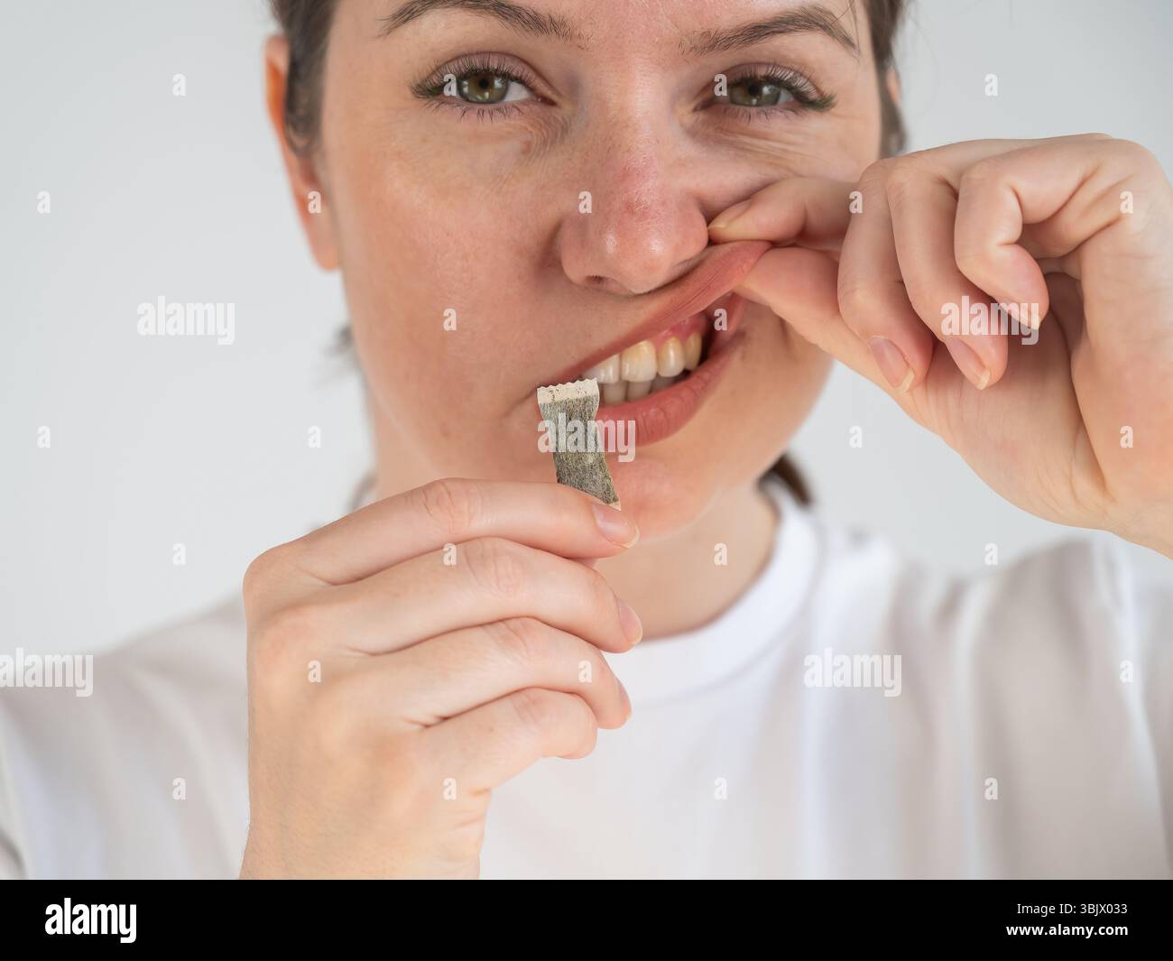 Woman Chewing Nicotine Snus Product Stock Photo - Alamy