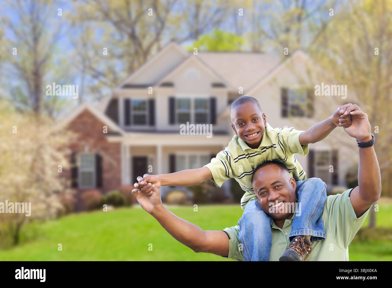 African American Father and Son In Front of House Stock Photo - Alamy