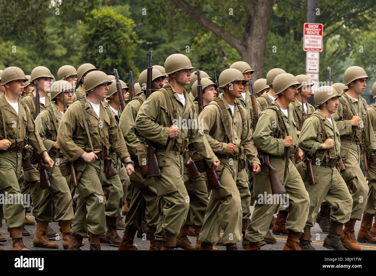 U.S. Army Soldiers in World War II-era uniforms march in formation ...