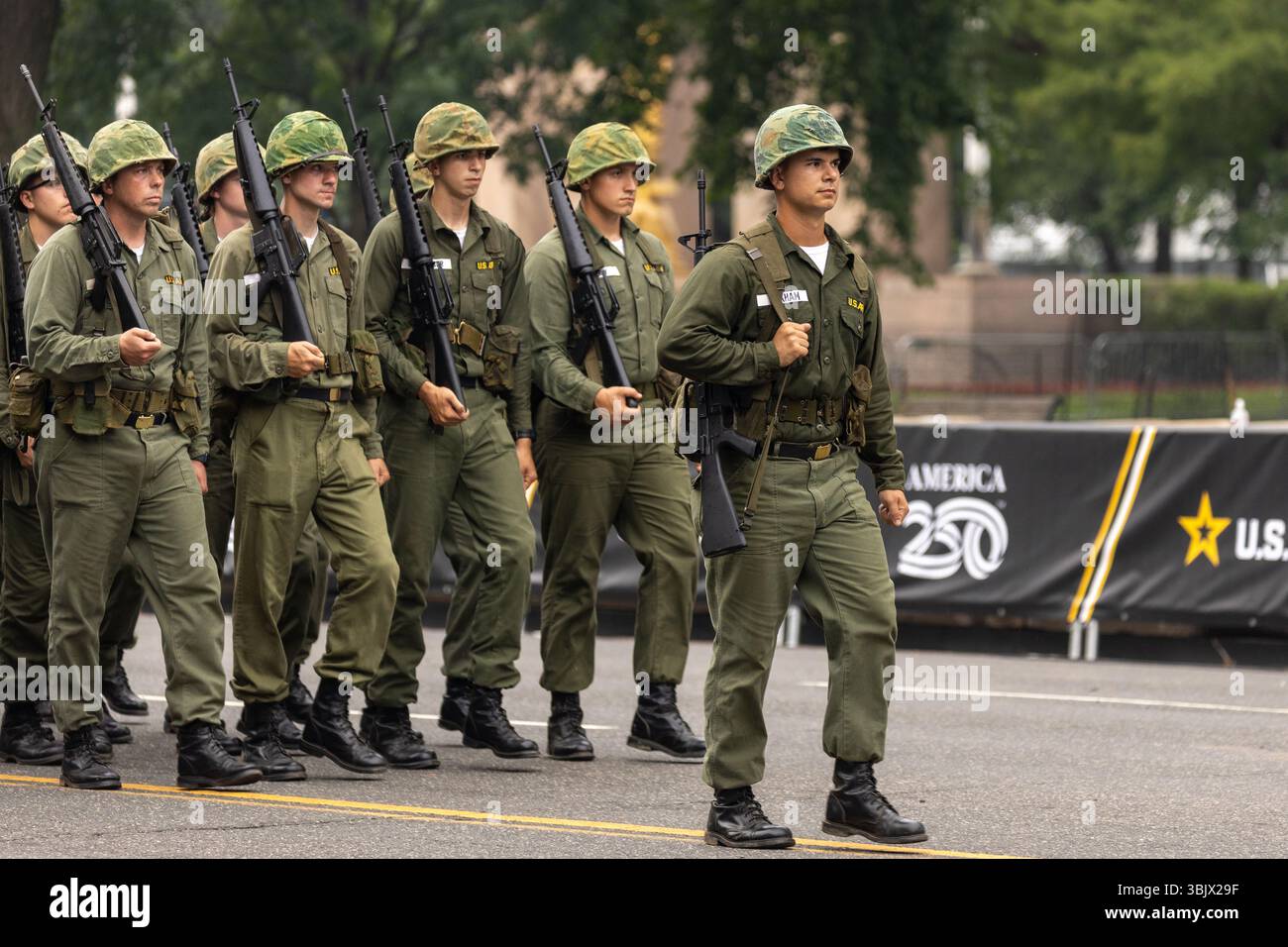 U.S. Soldiers dressed in Vietnam-era uniforms march in formation during ...