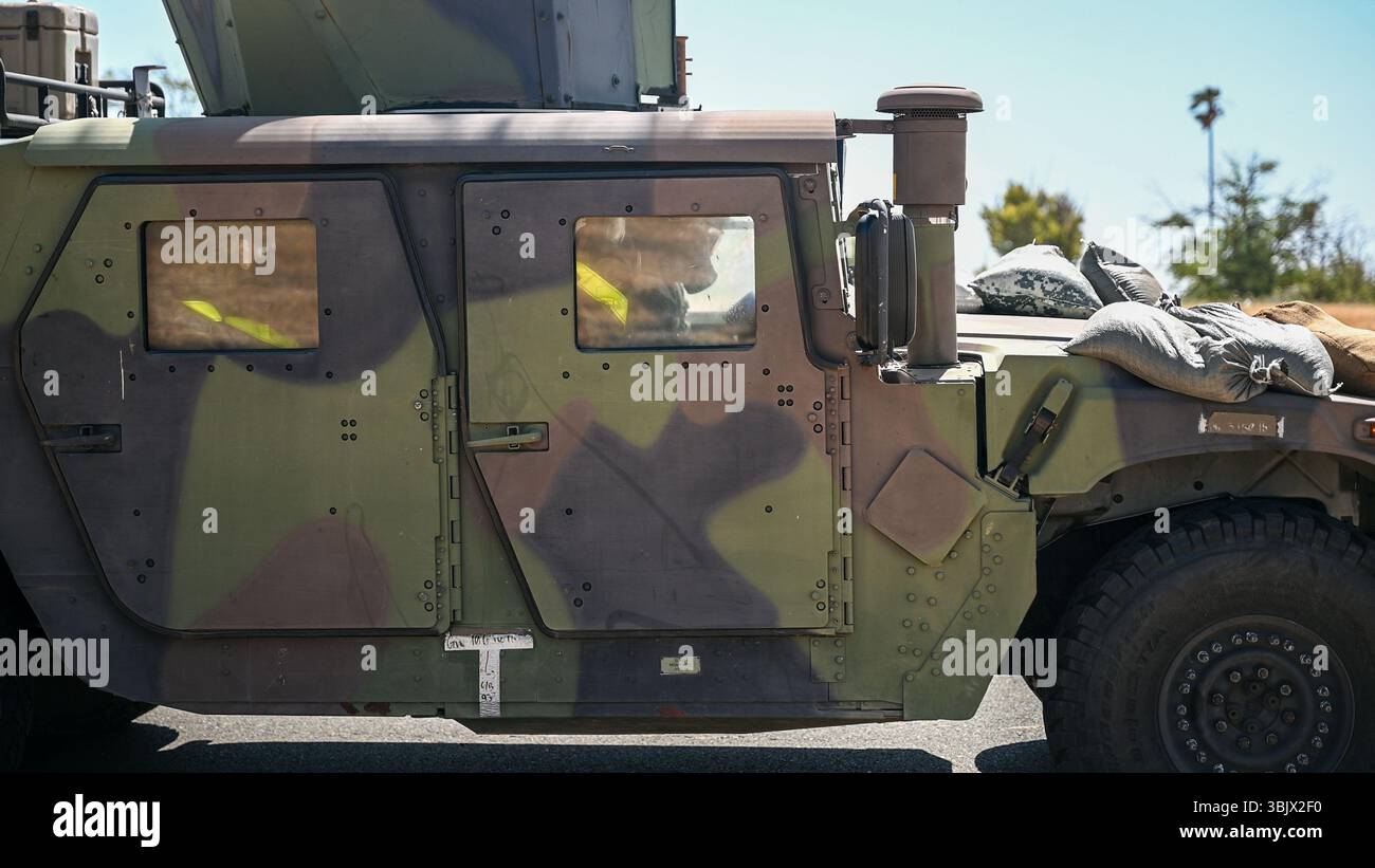 Airmen from the 349th Security Forces Squadron (SFS) operate a High ...